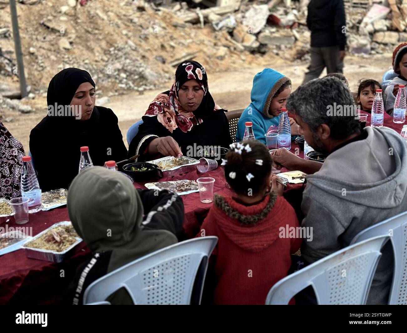 Palestinians break their fast by eating the Iftar meals during the holy ...
