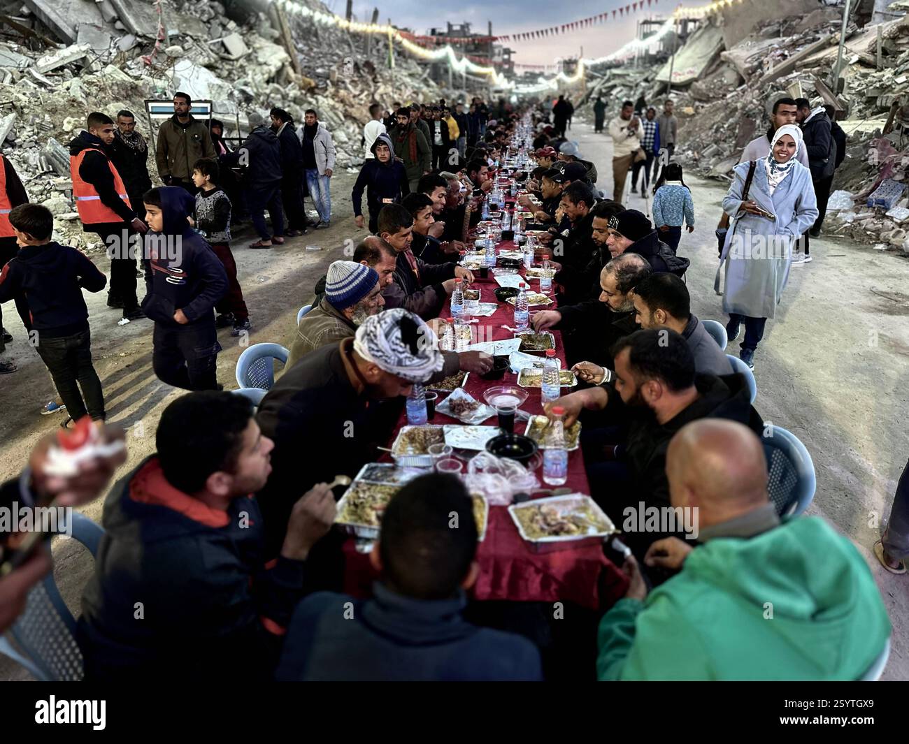 Palestinians break their fast by eating the Iftar meals during the holy ...