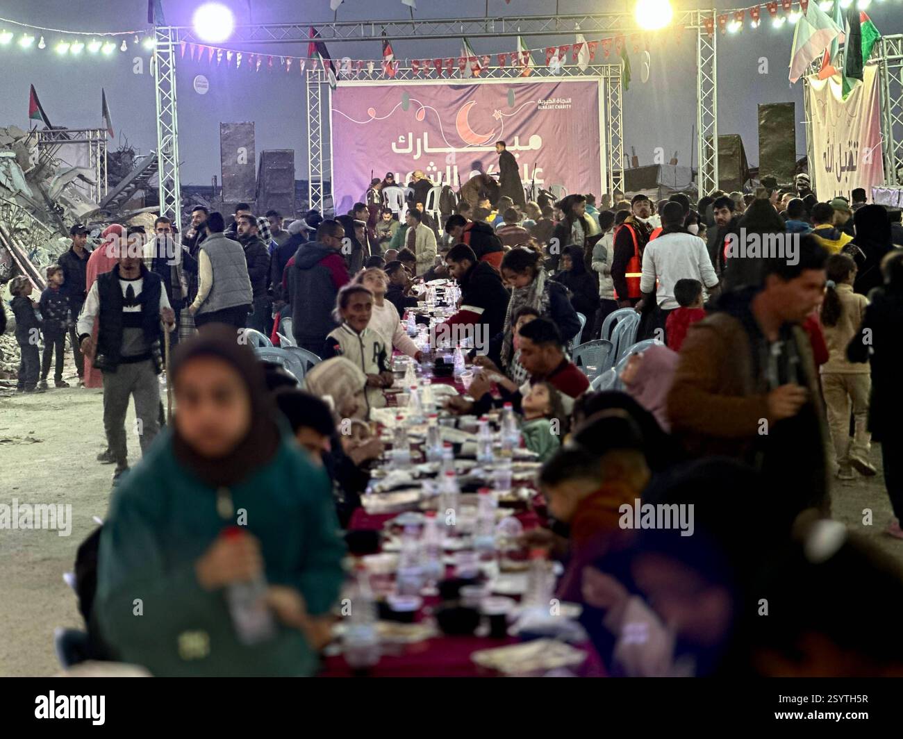 Palestinians break their fast by eating the Iftar meals during the holy ...