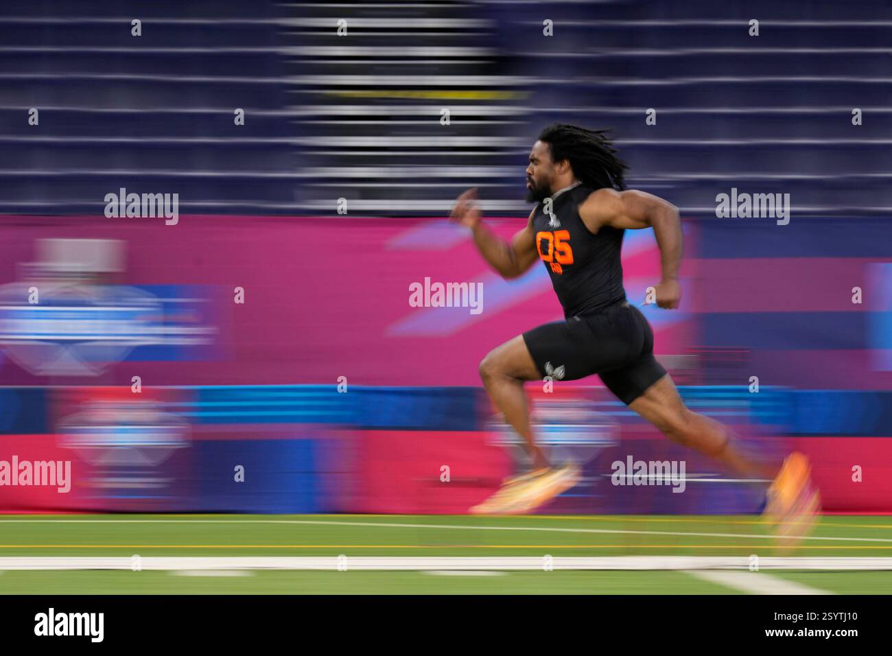 Michigan running back Donovan Edwards runs the 40-yard dash at the NFL ...