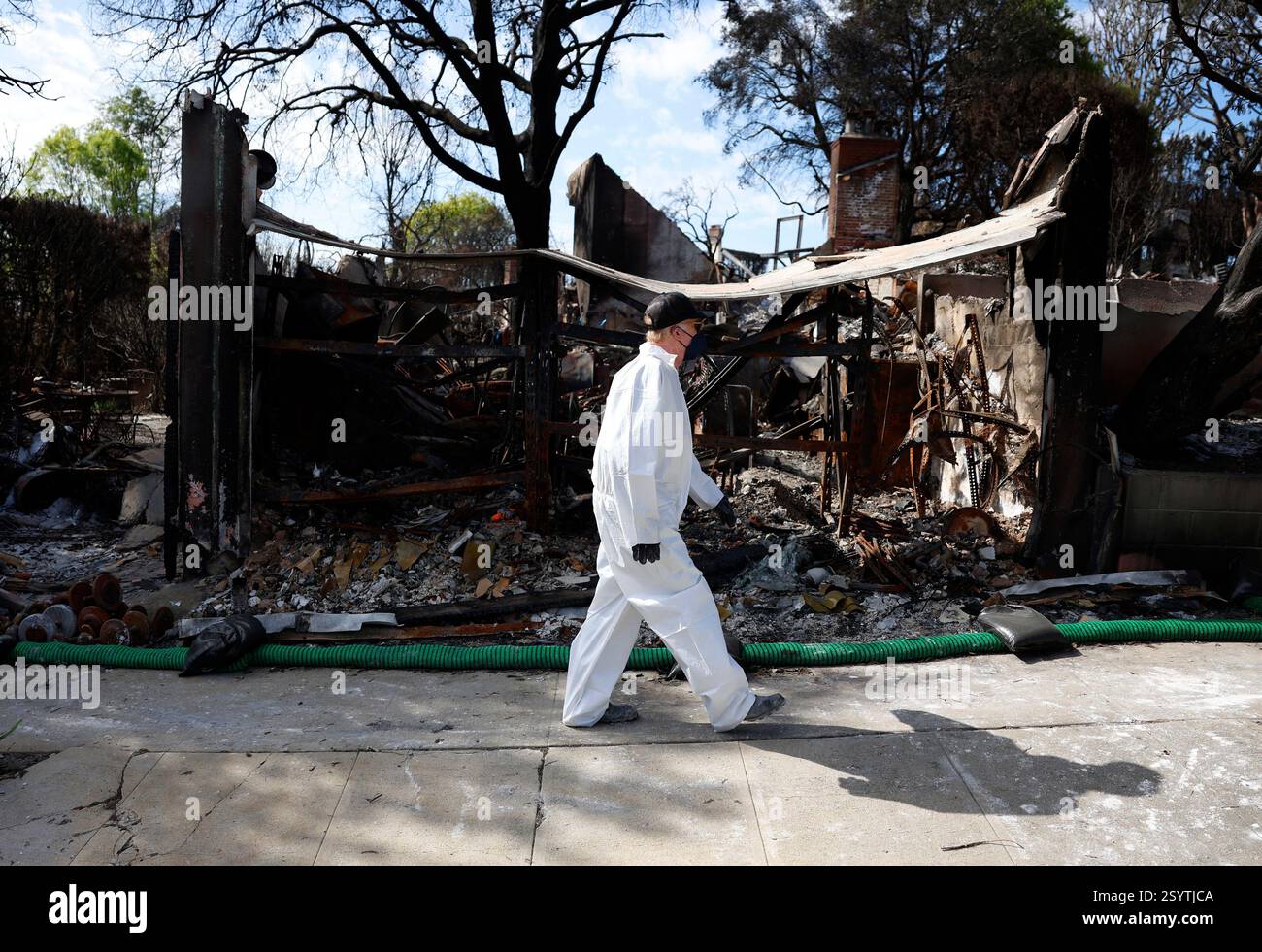 Home owner Robert Reiff examines the rubble and remains of his home ...