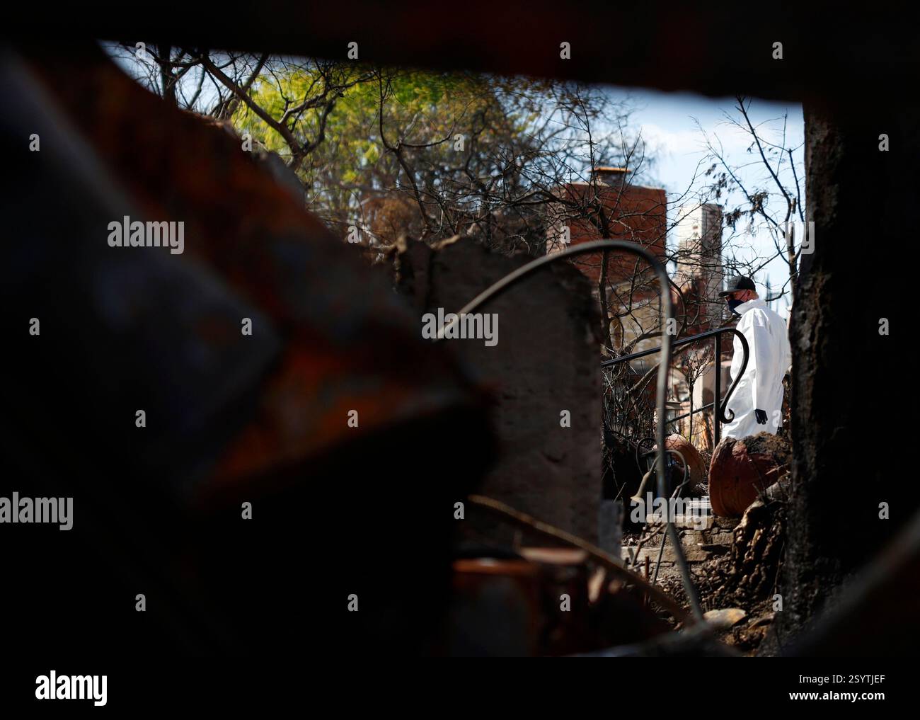 Home owner Robert Reiff examines the rubble and remains of his home ...