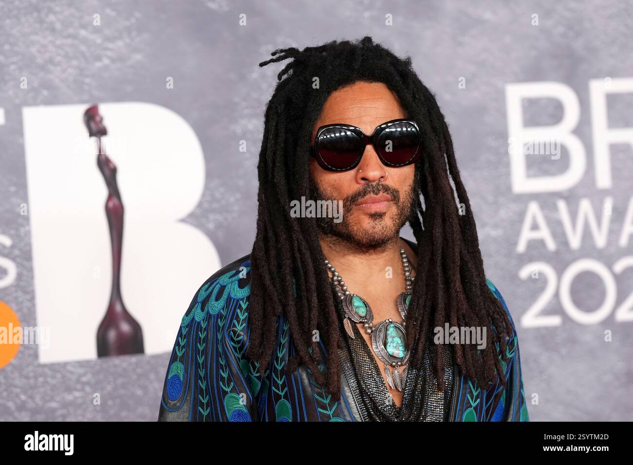 Lenny Kravitz poses for photographers upon arrival at the Brit Awards ...