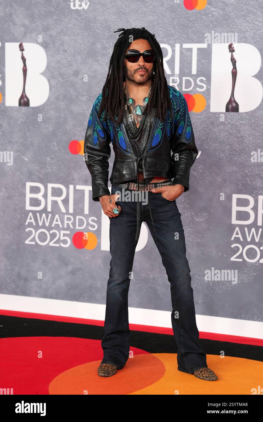 Lenny Kravitz poses for photographers upon arrival at the Brit Awards ...