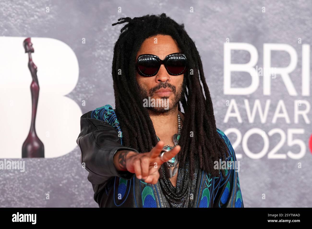 Lenny Kravitz poses for photographers upon arrival at the Brit Awards ...