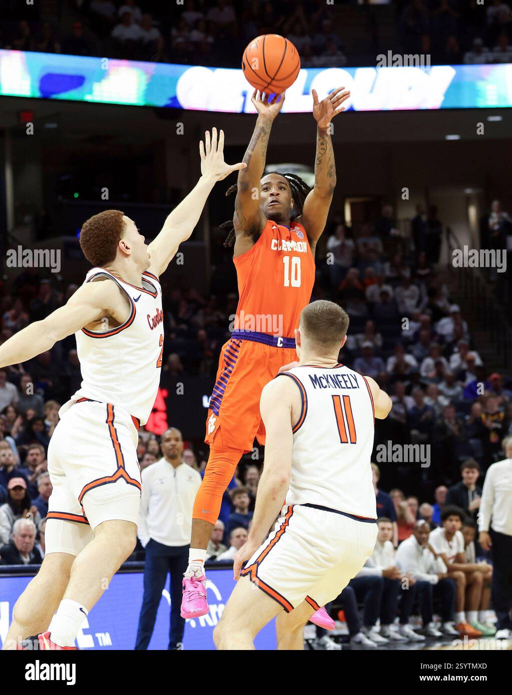 Clemson guard Del Jones (10) shoots over Virginia guard Elijah Saunders ...