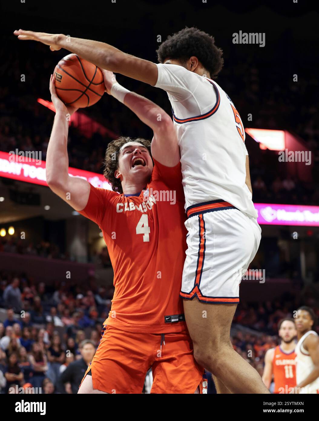 Clemson forward Ian Schieffelin (4) is fouled by Virginia forward Jacob ...
