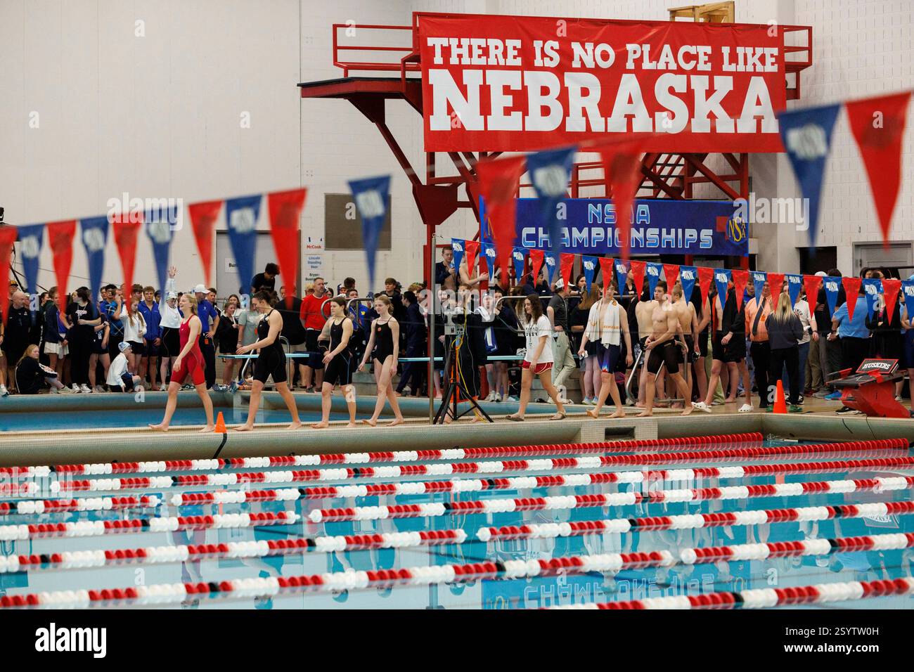 Swimmers walk out during the parade of champions before the Nebraska ...