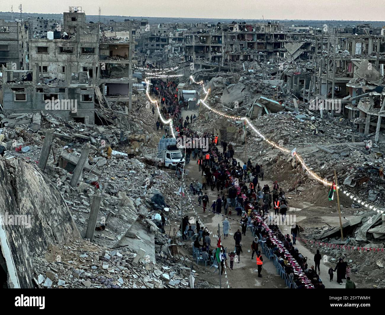 Palestinians break their fast by eating the Iftar meals during the holy ...