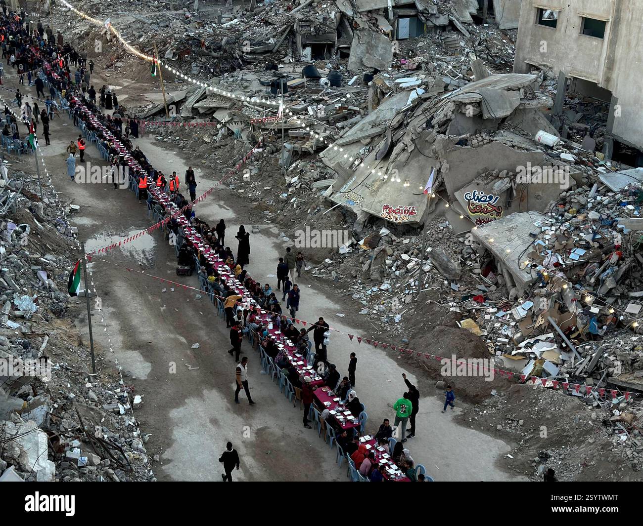 Palestinians break their fast by eating the Iftar meals during the holy ...