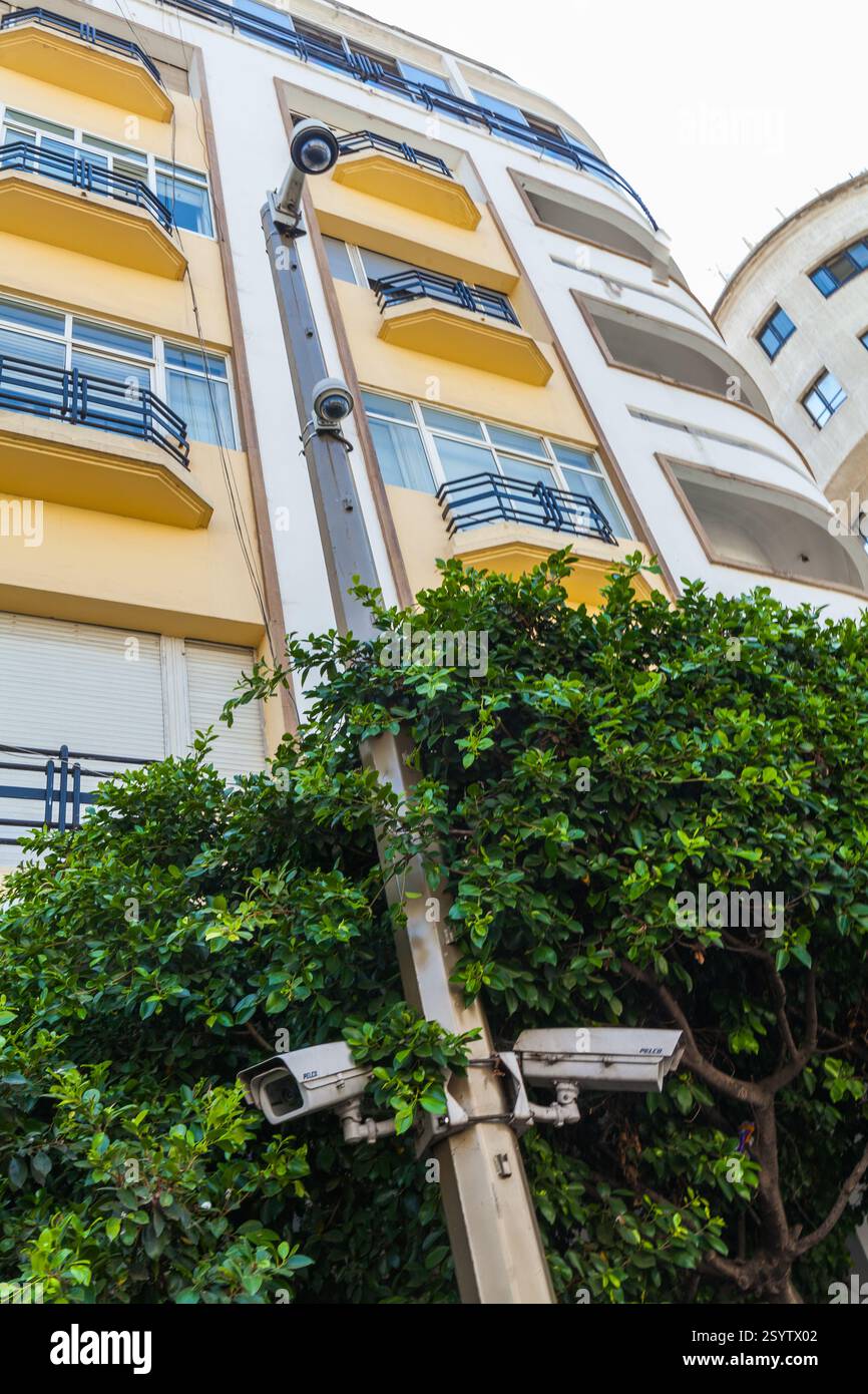 modern residential building with multiple balconies and a security ...