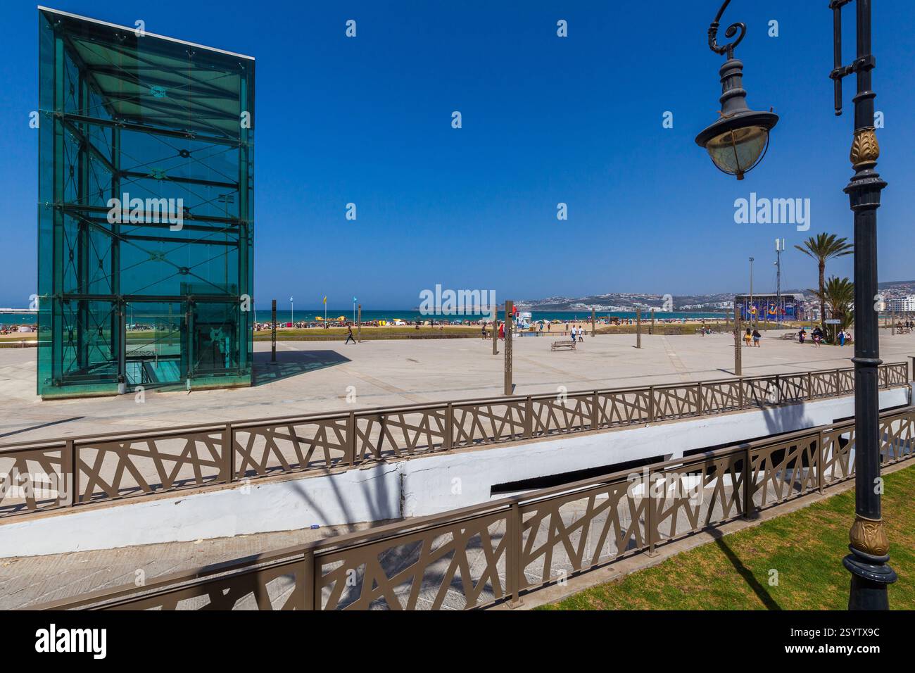 modern coastal promenade with a striking glass structure as a ...