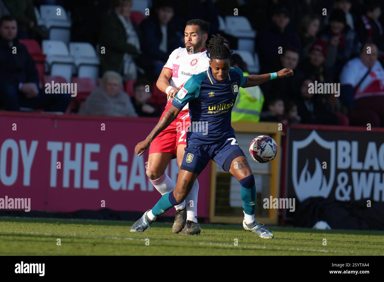 Tawanda Chirewa of Huddersfield Town and Louis Thompson of Stevenage ...