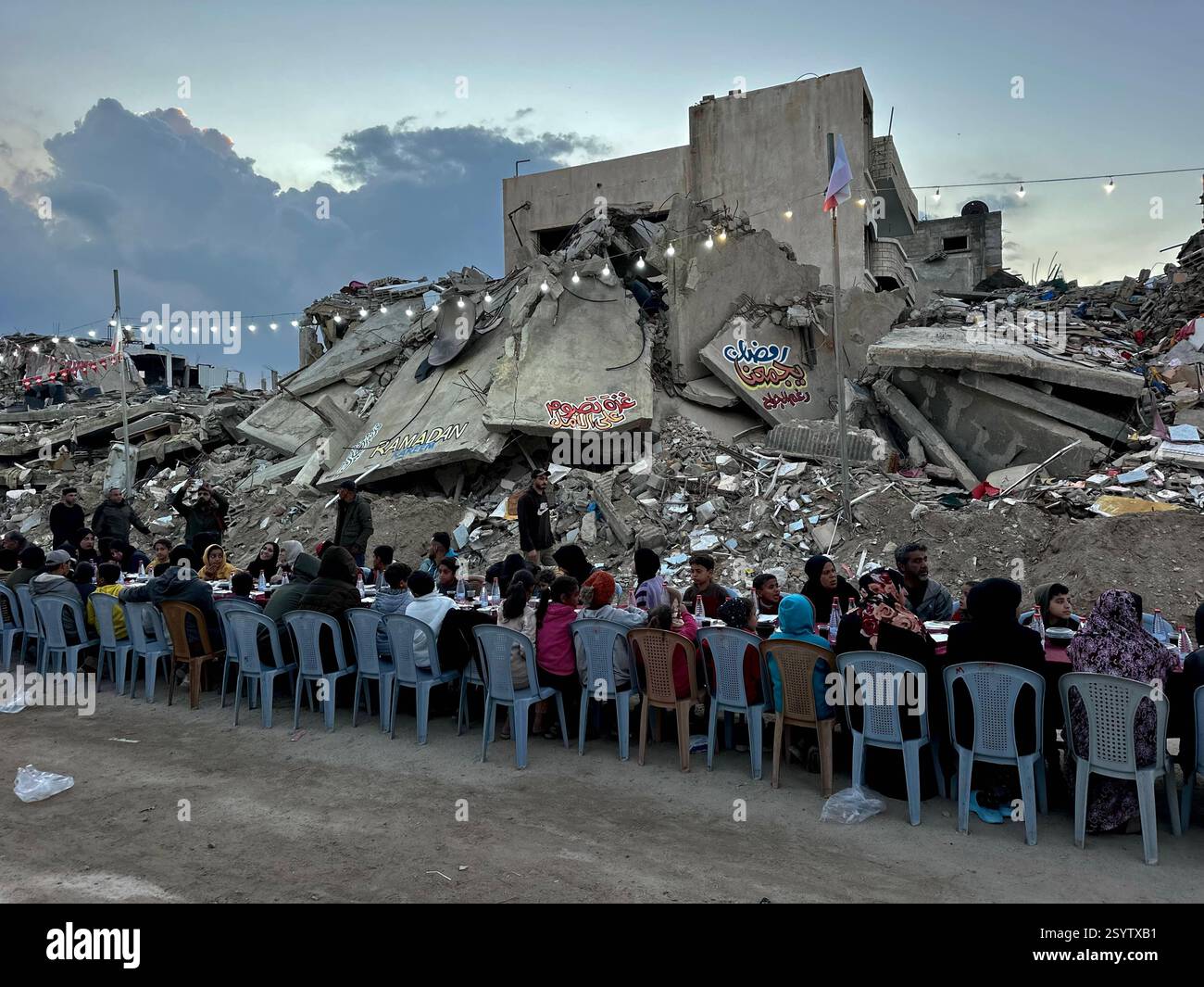 Palestinians break their fast by eating the Iftar meals during the holy ...