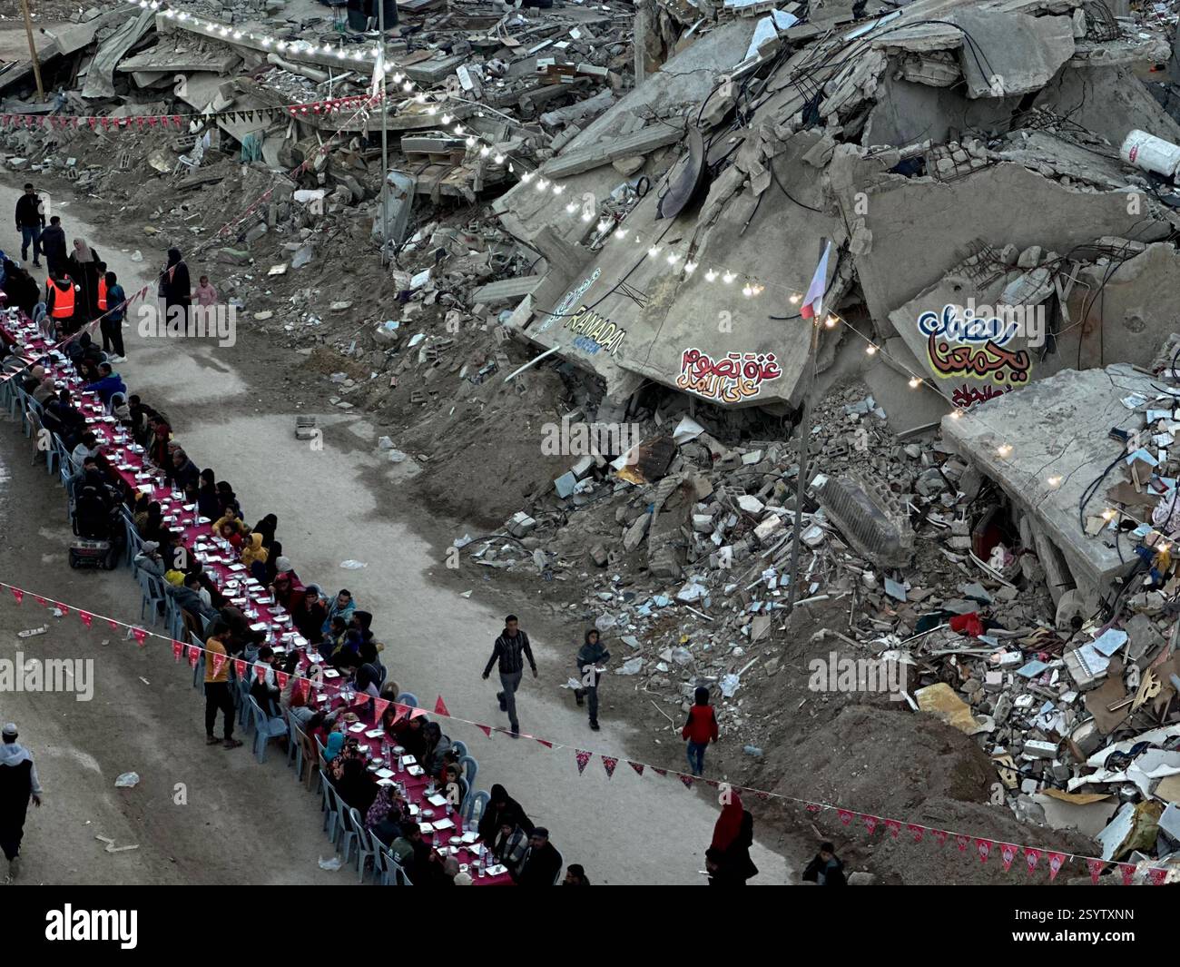 Palestinians break their fast by eating the Iftar meals during the holy ...