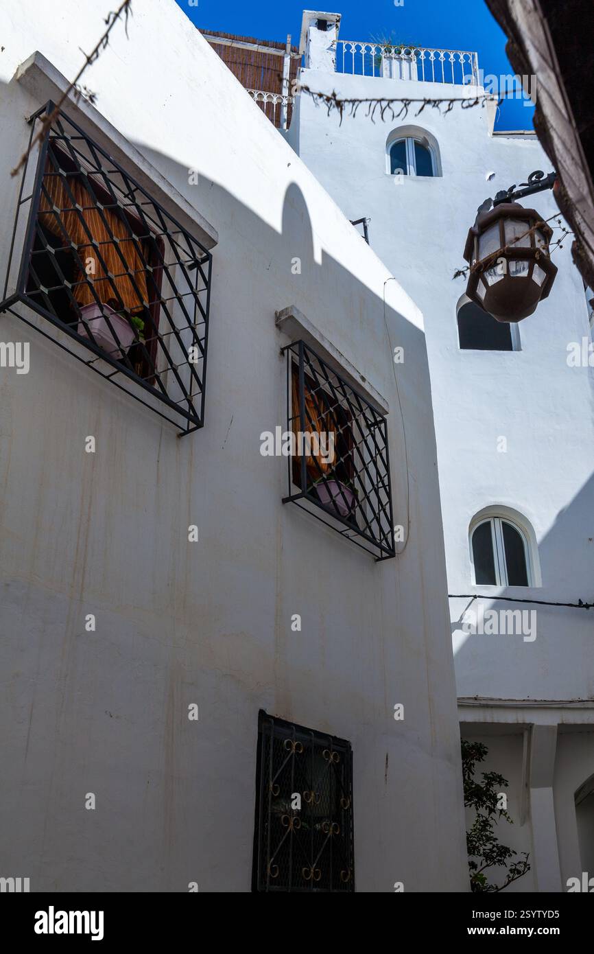traditional whitewashed building with a charming balcony, nestled ...