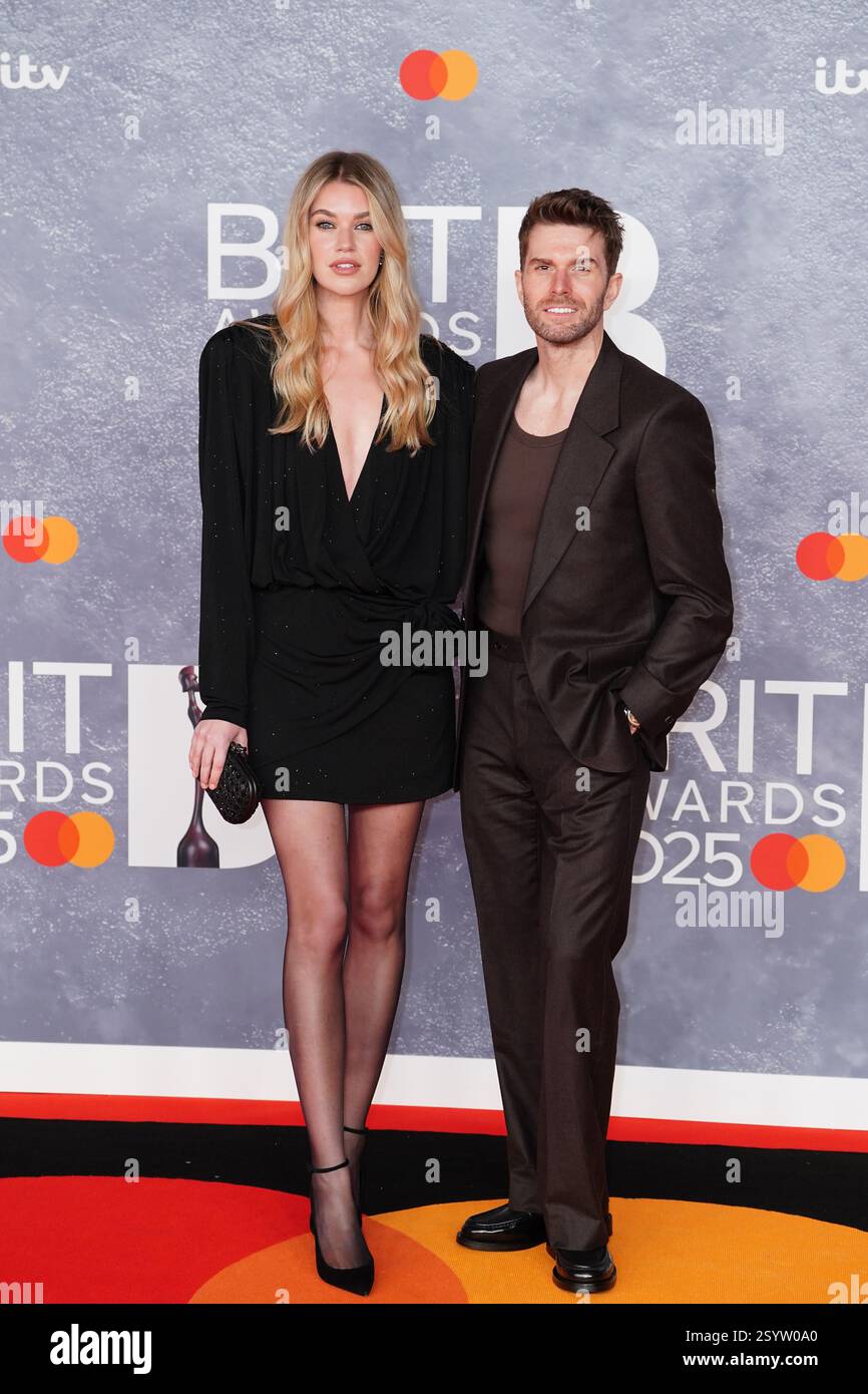 Hannah Cooper and Joel Dommett arriving for The BRIT Awards 2025 at ...