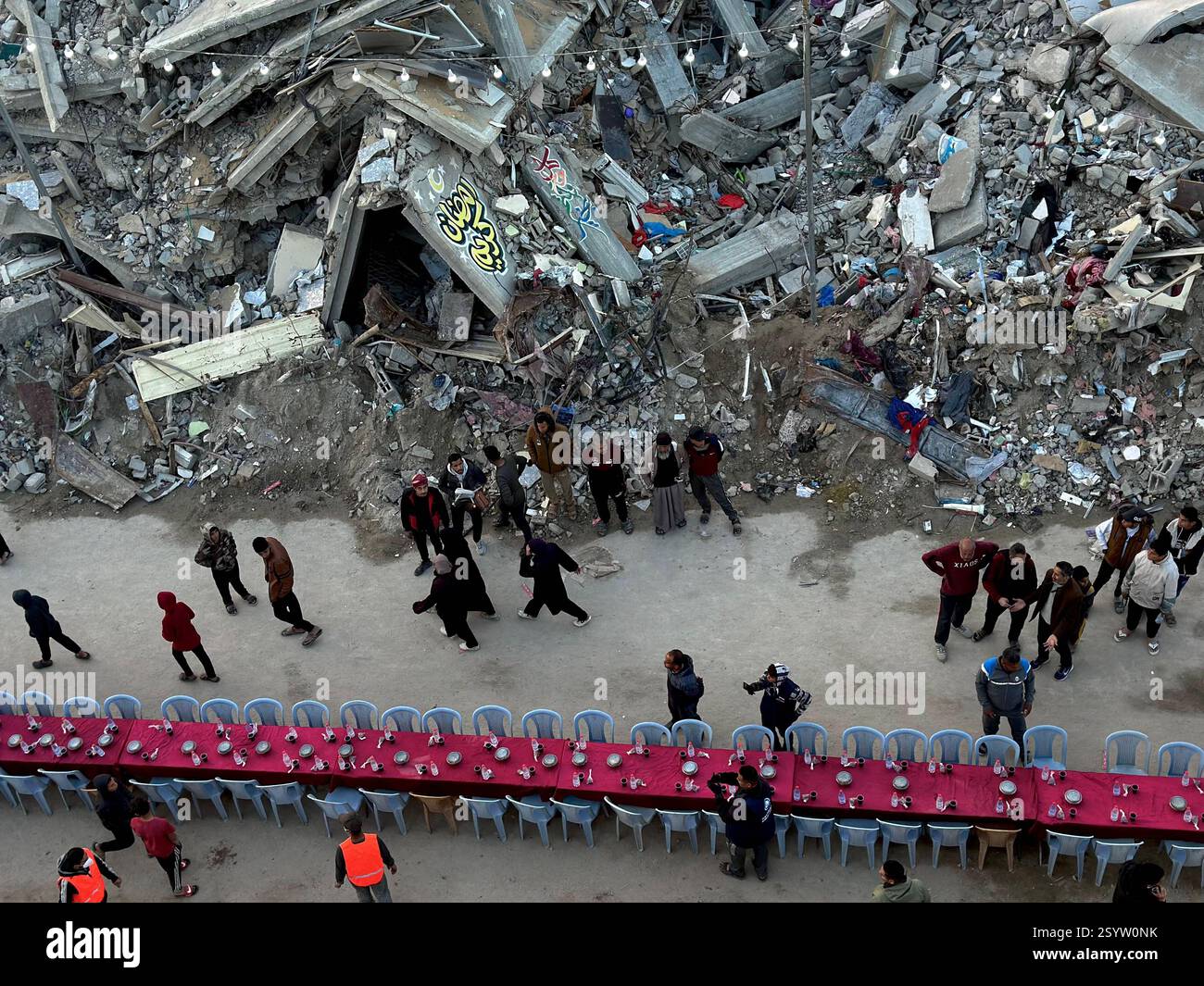 Palestinians break their fast by eating the Iftar meals during the holy ...