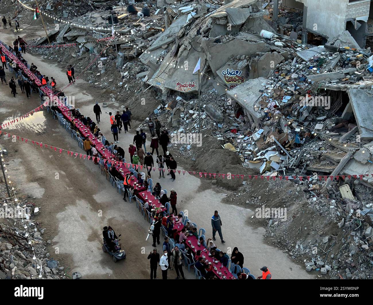 Palestinians break their fast by eating the Iftar meals during the holy ...