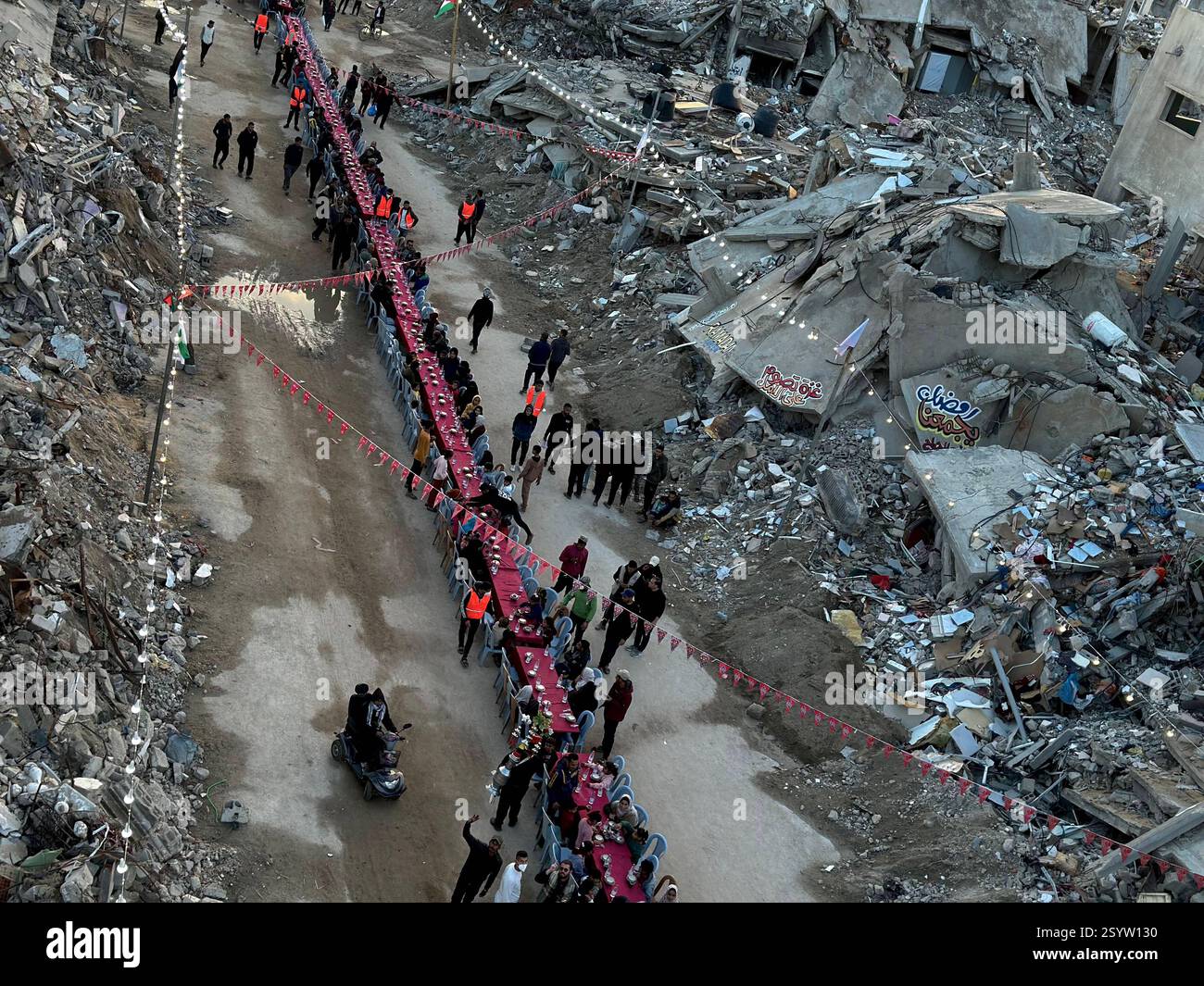 Palestinians break their fast by eating the Iftar meals during the holy ...