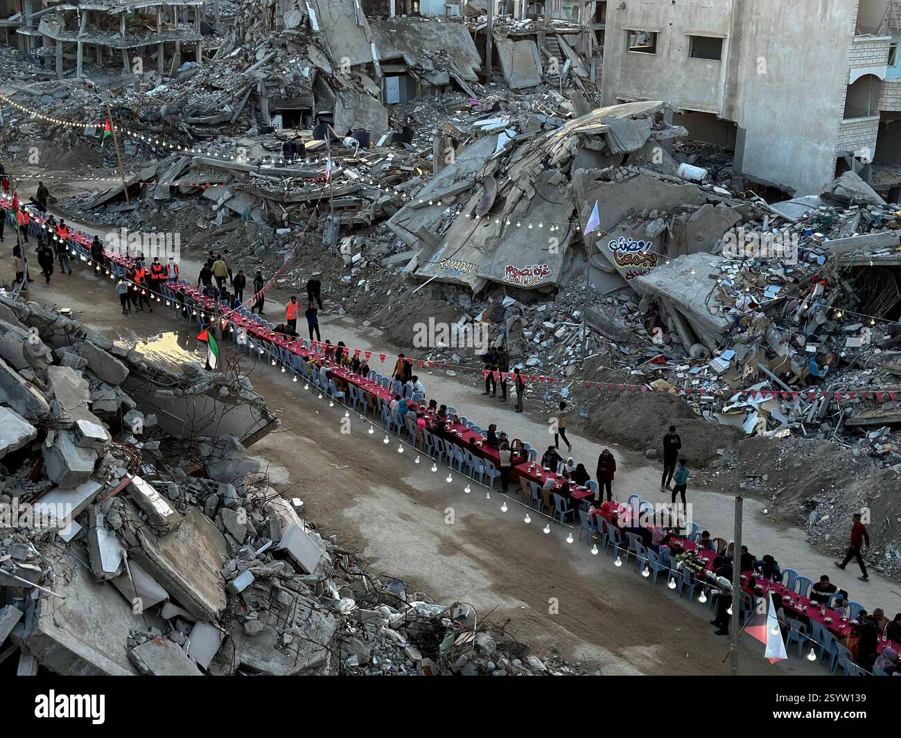 Palestinians break their fast by eating the Iftar meals during the holy ...