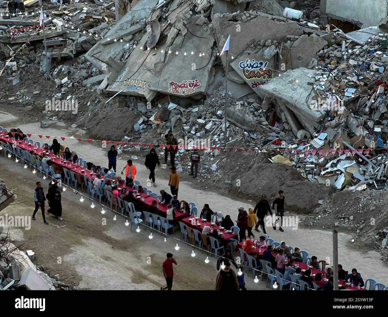 Palestinians break their fast by eating the Iftar meals during the holy ...