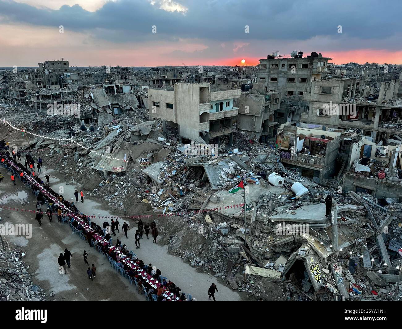 Palestinians break their fast by eating the Iftar meals during the holy ...