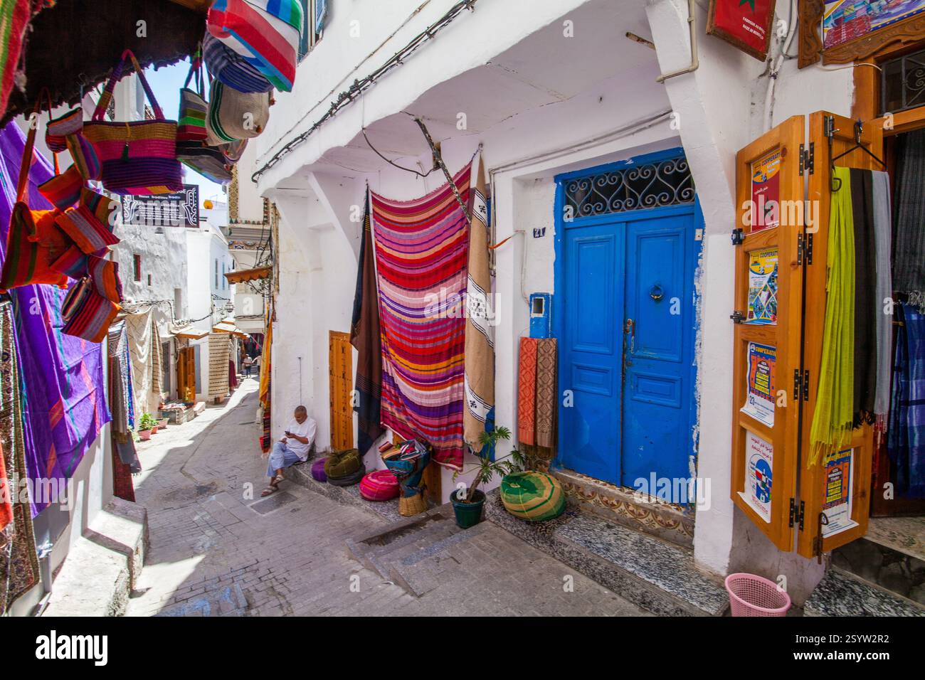vibrant street scene in a Mediterranean town, featuring colorful ...