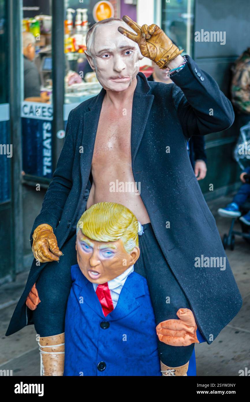 A Vladamir Putin character is carried on the shoulders of a Donald ...