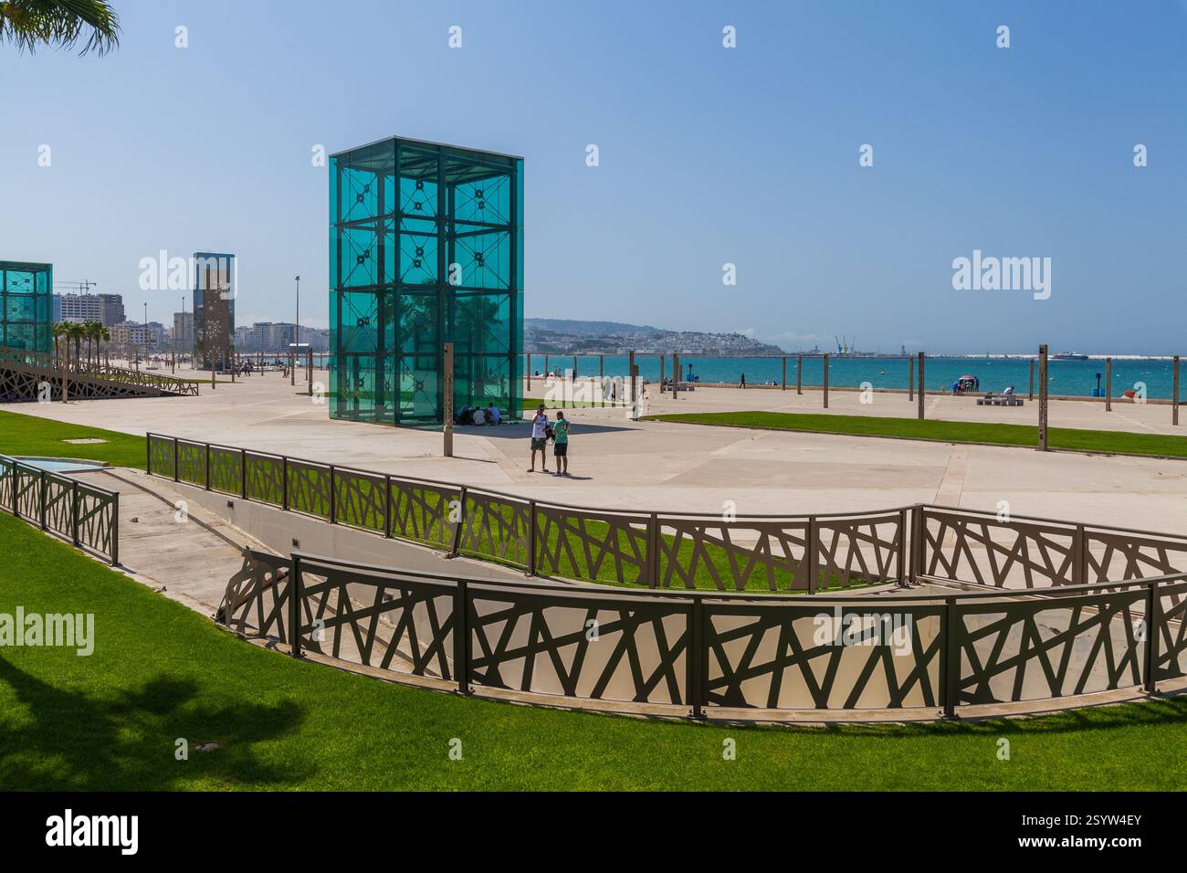 modern coastal promenade with a striking glass structure as a ...