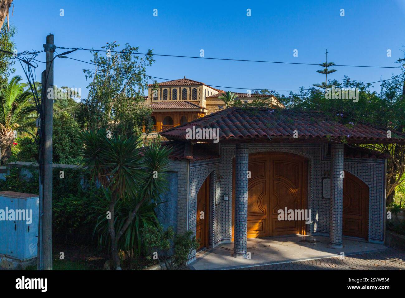 grand villa with a traditional Moroccan architectural style, featuring ...