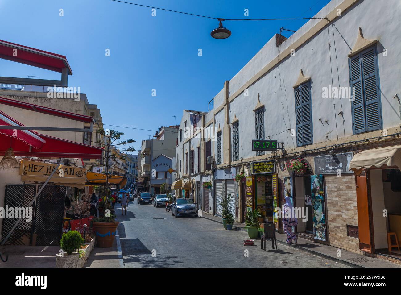 street scene in a bustling city, with colorful storefronts, bustling ...