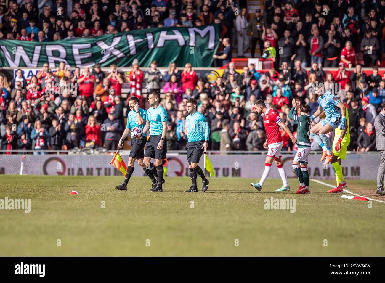 Referee Declan Bourne alongside Assistant Referee Daniel Woodward and ...