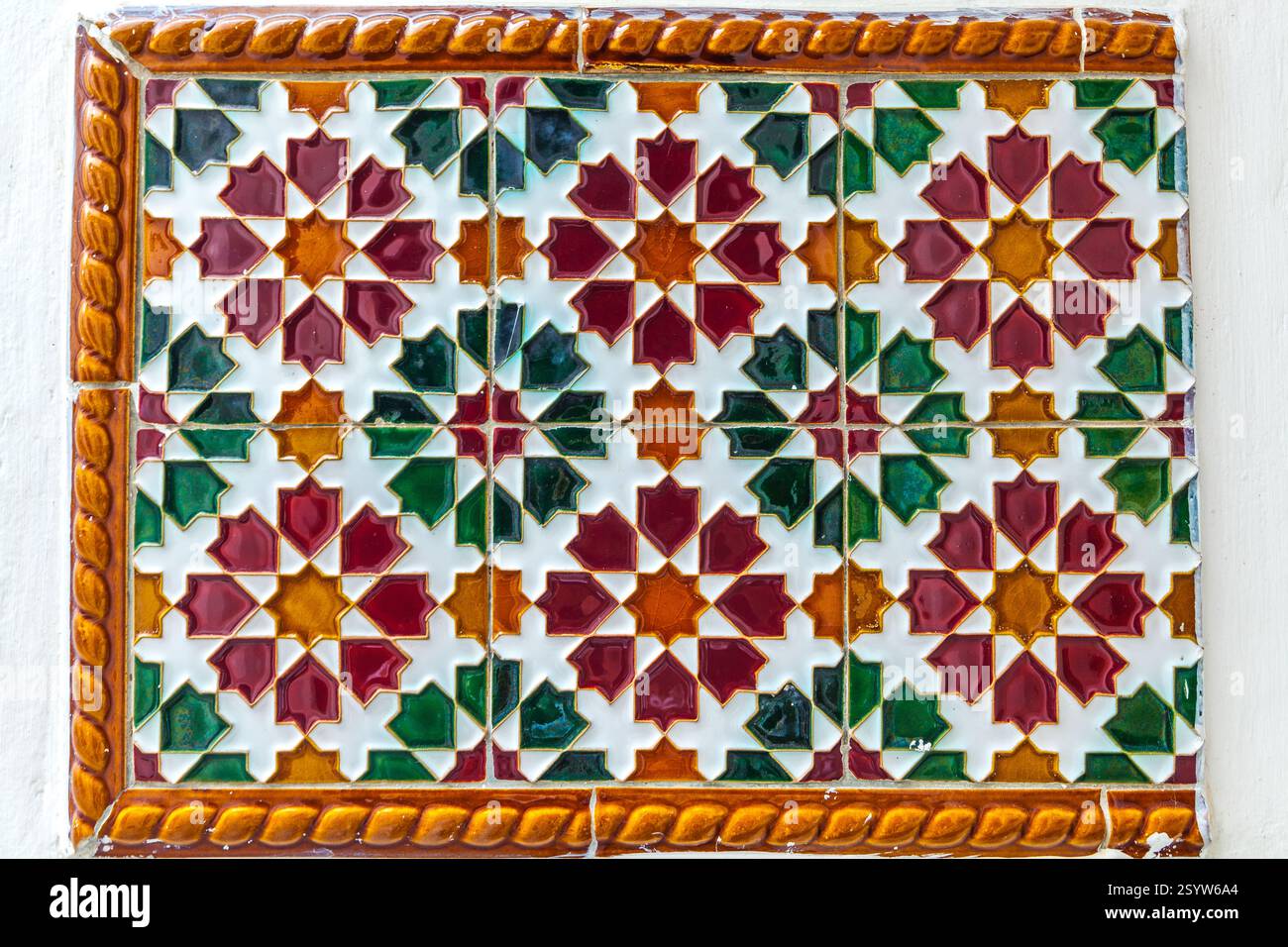vibrant and intricate tile panel with a geometric pattern in shades of ...