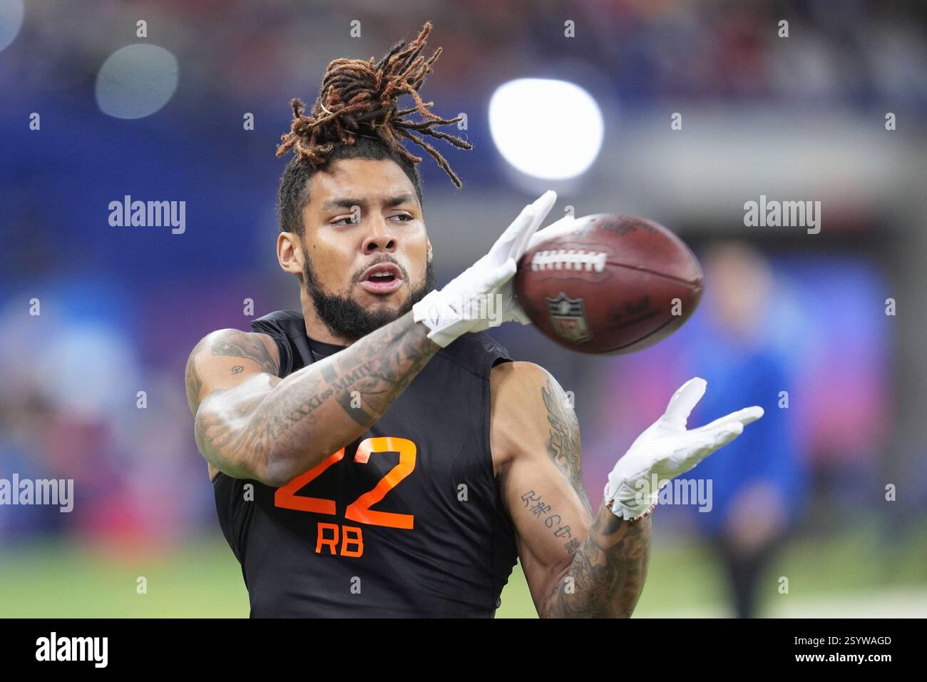 Miami running back Damien Martinez runs a drill at the NFL football ...