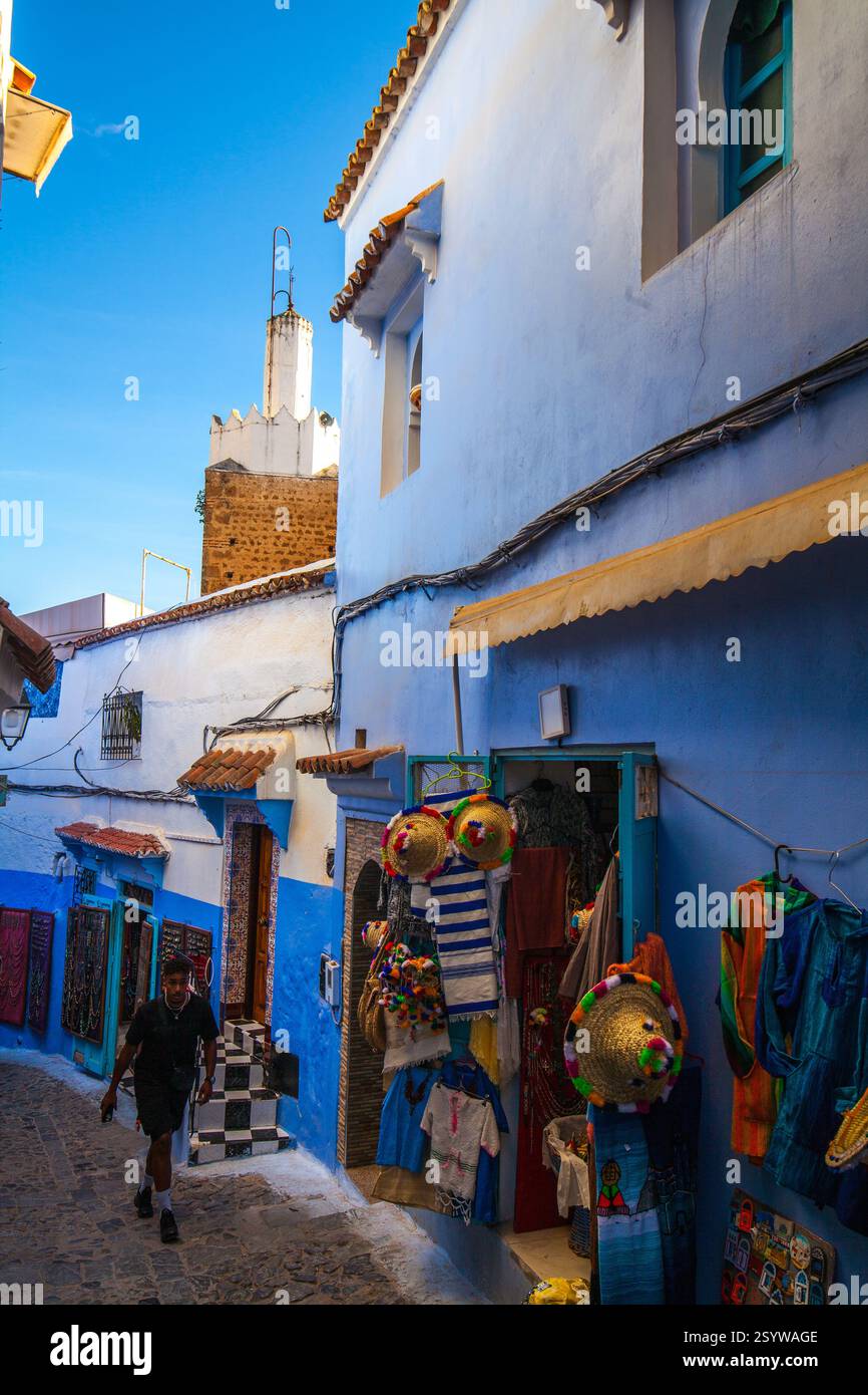 street scene in a blue-washed town Chefchaouen, featuring colorful ...