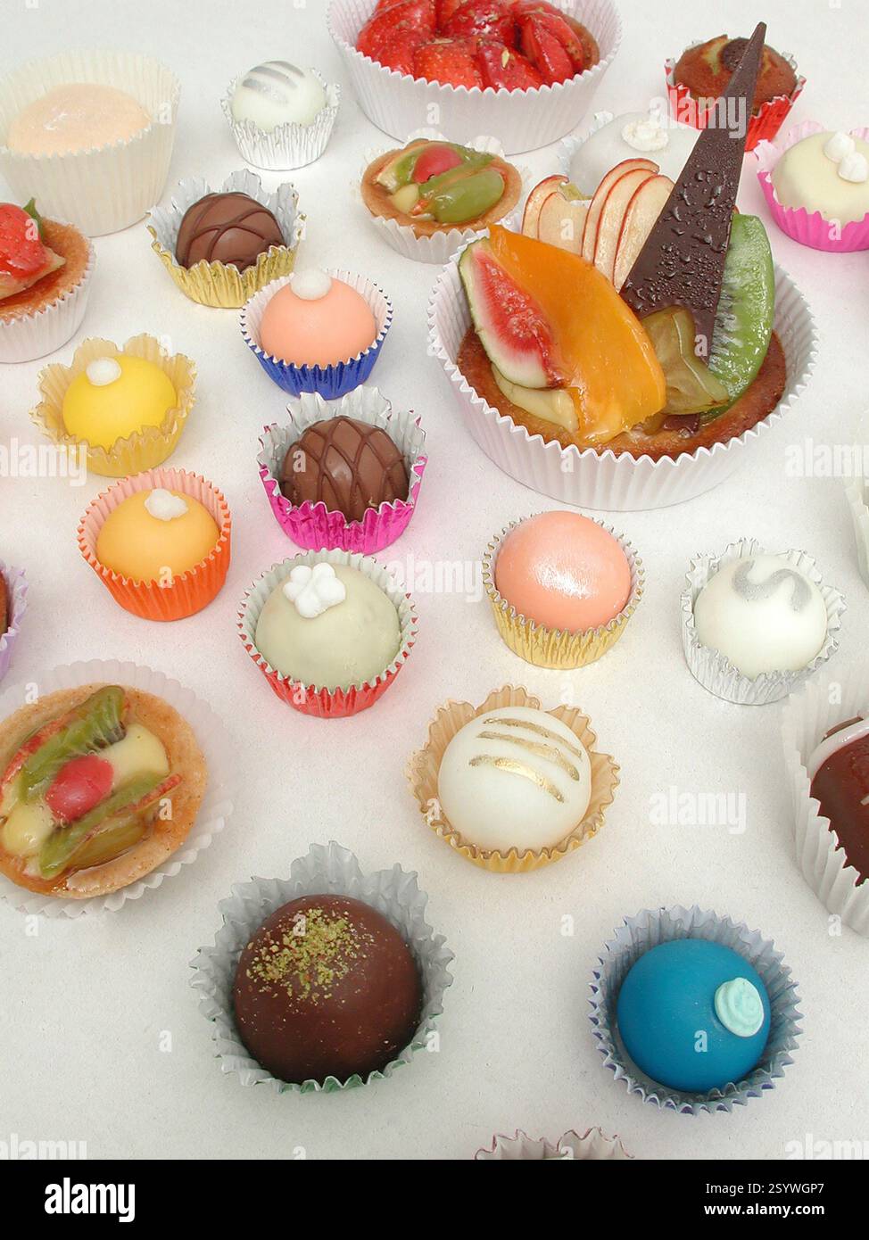 top view of candy and delicacy to birthday party on white background ...