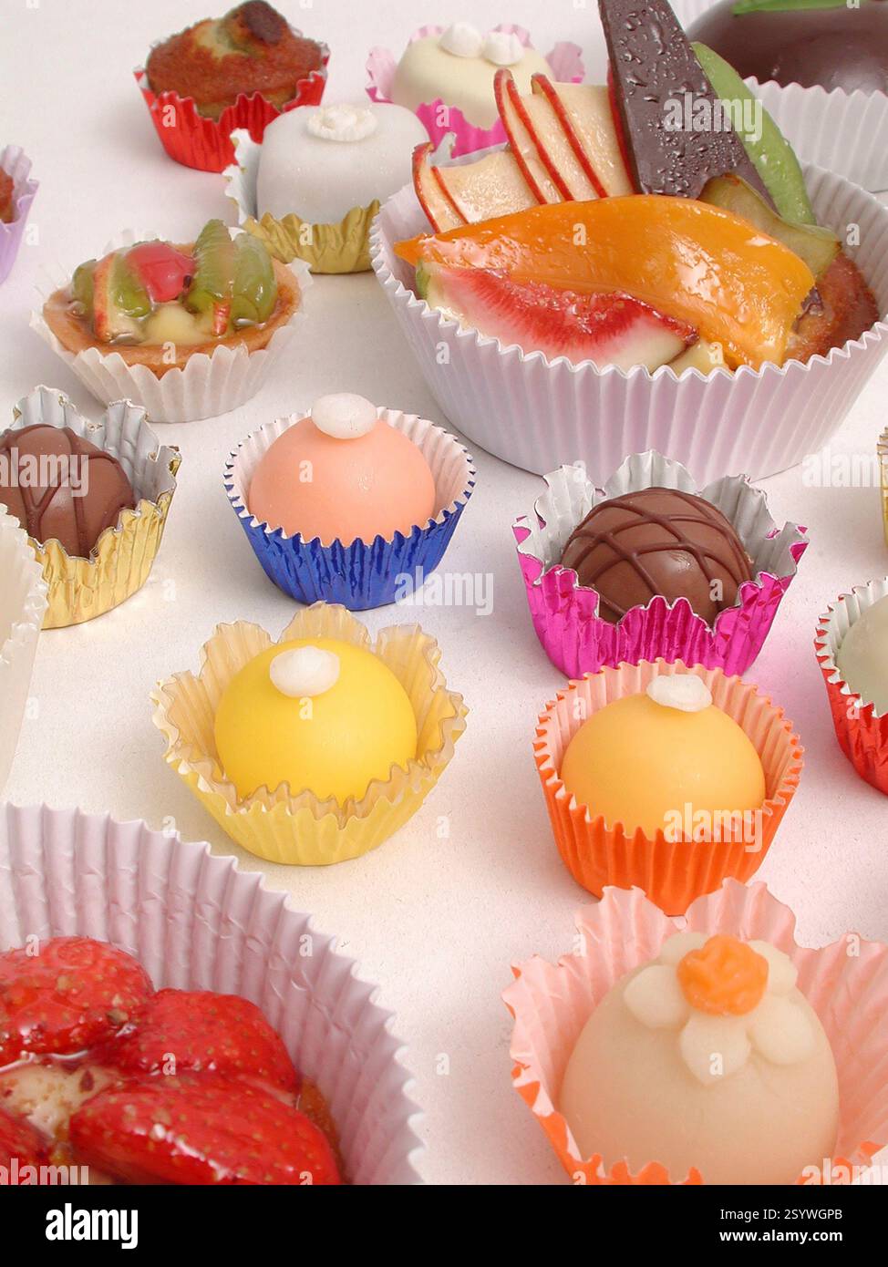 top view of candy and delicacy to birthday party on white background ...