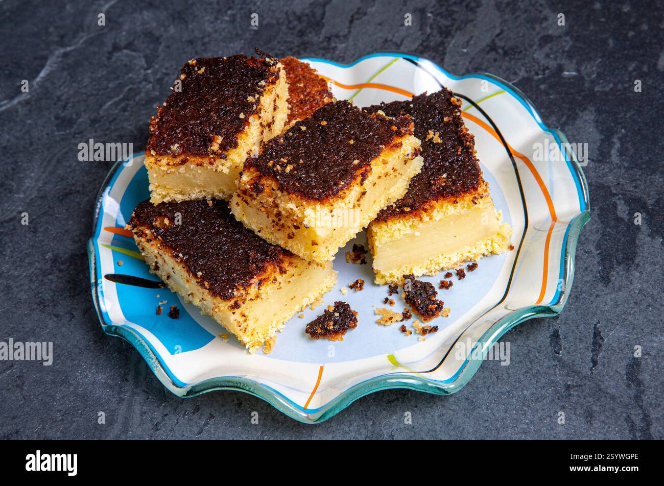 Brazilian creamy corn cake made with a type of corn flour, on dark ...