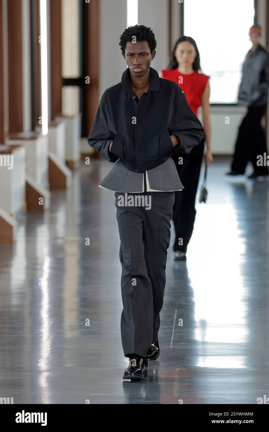 Milan, Italy. 01st Mar, 2025. A model walks on the runway during the ...