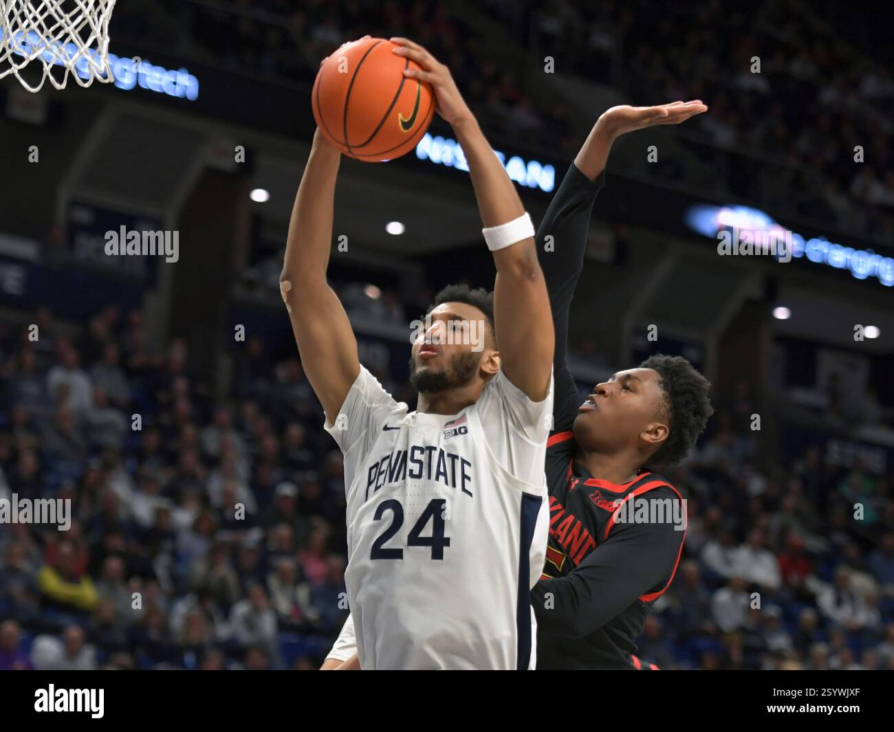 Penn State's Zach Hicks (24) pulls down a rebound in front of Maryland ...
