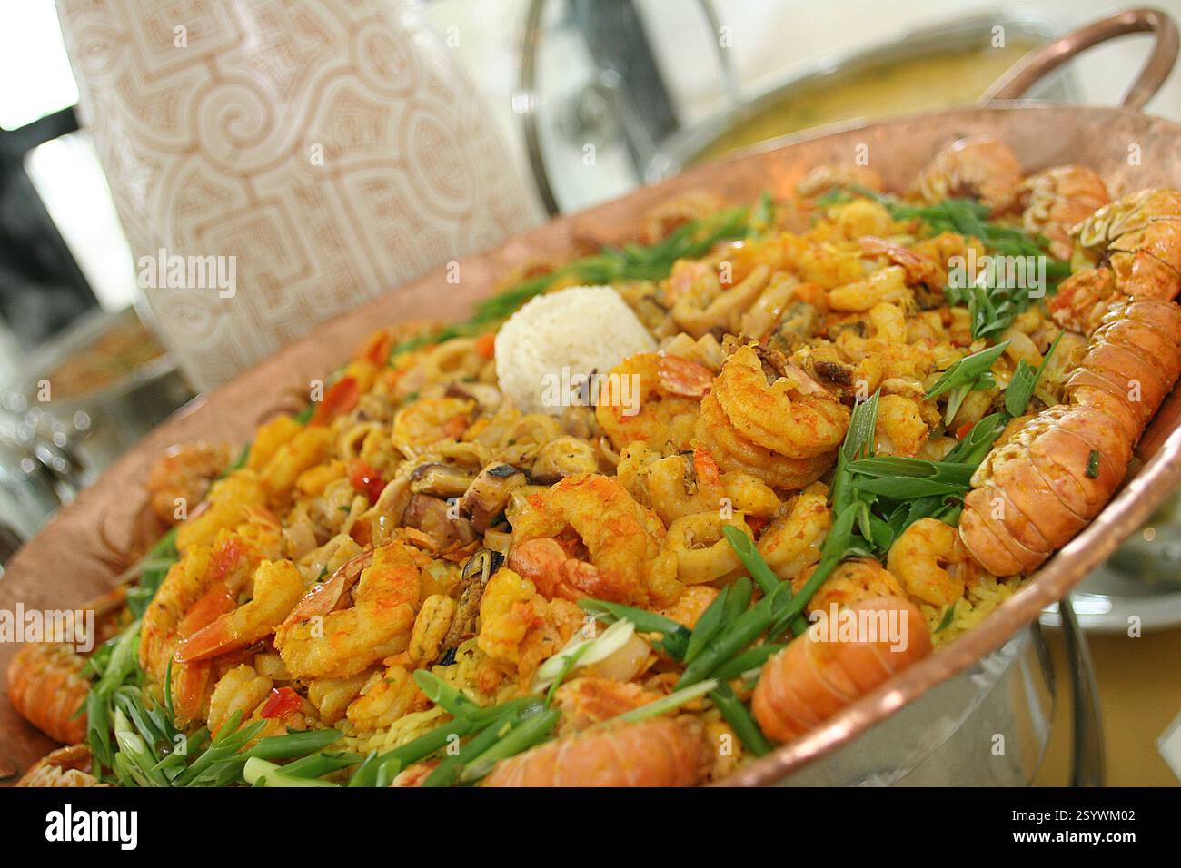 Close up view of a Spanish seafood paella: mussels, king prawns ...