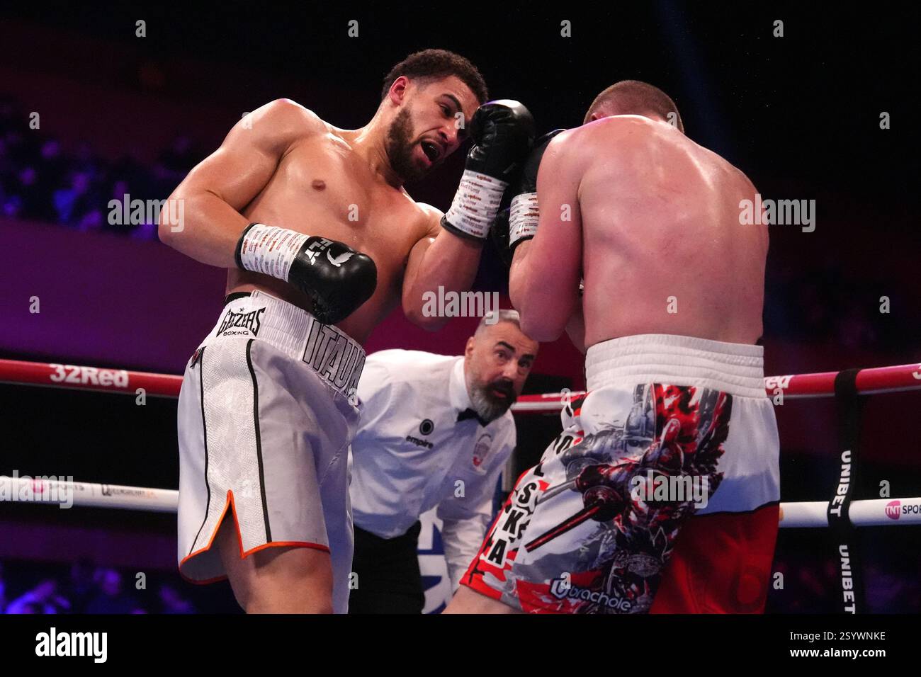 Karol Itauma (left) in action against Michal Ludwiczak in the light ...