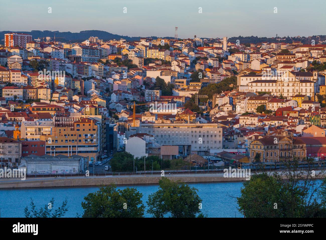 A sprawling cityscape with diverse architecture, including prominent ...