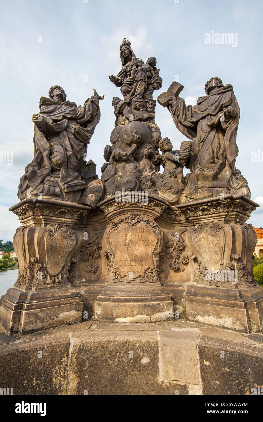 A stone bridge adorned with statues, including a prominent group ...