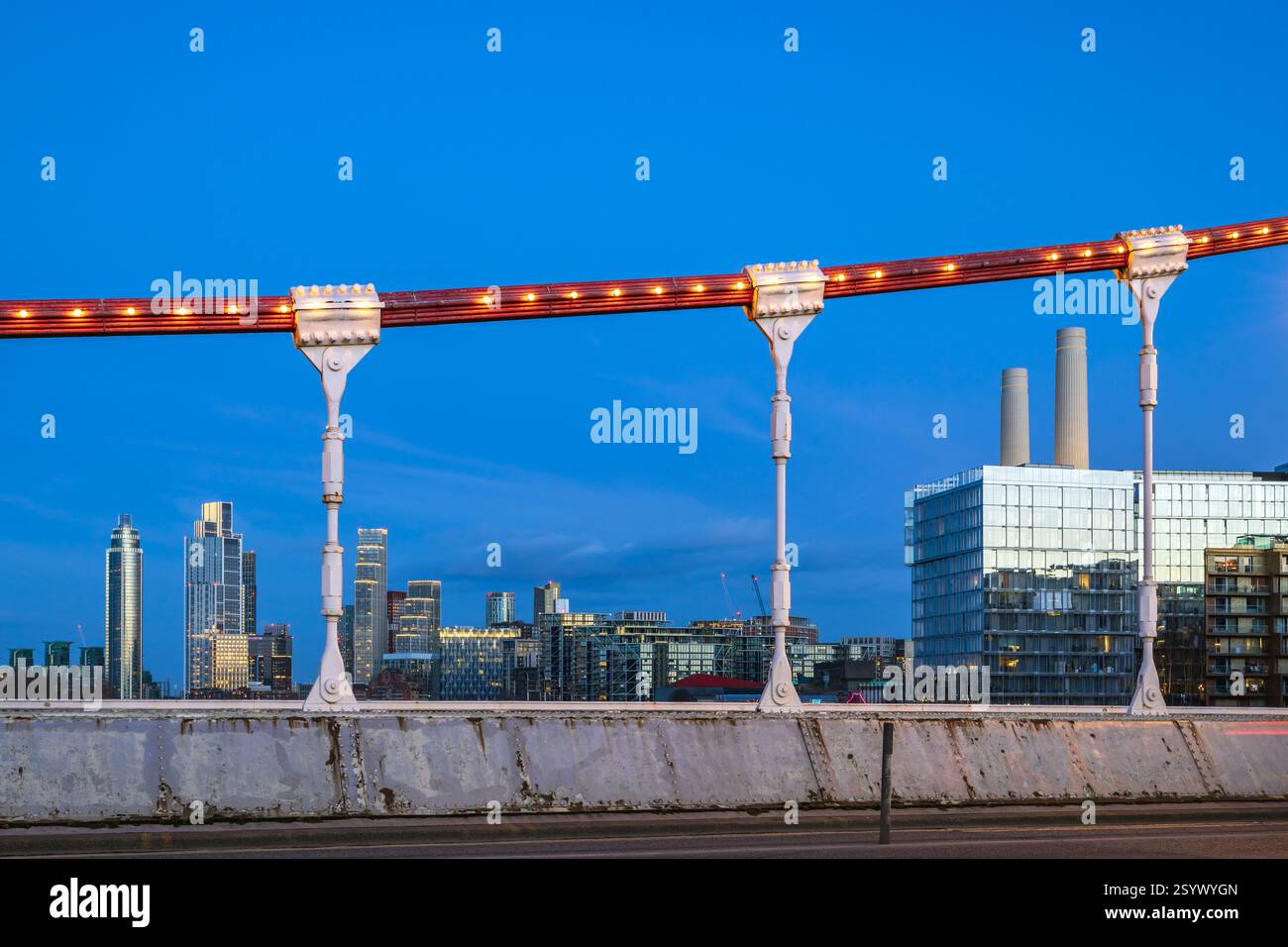 London skyline at dusk, taken from Chelsea Bridge, a bridge over the ...