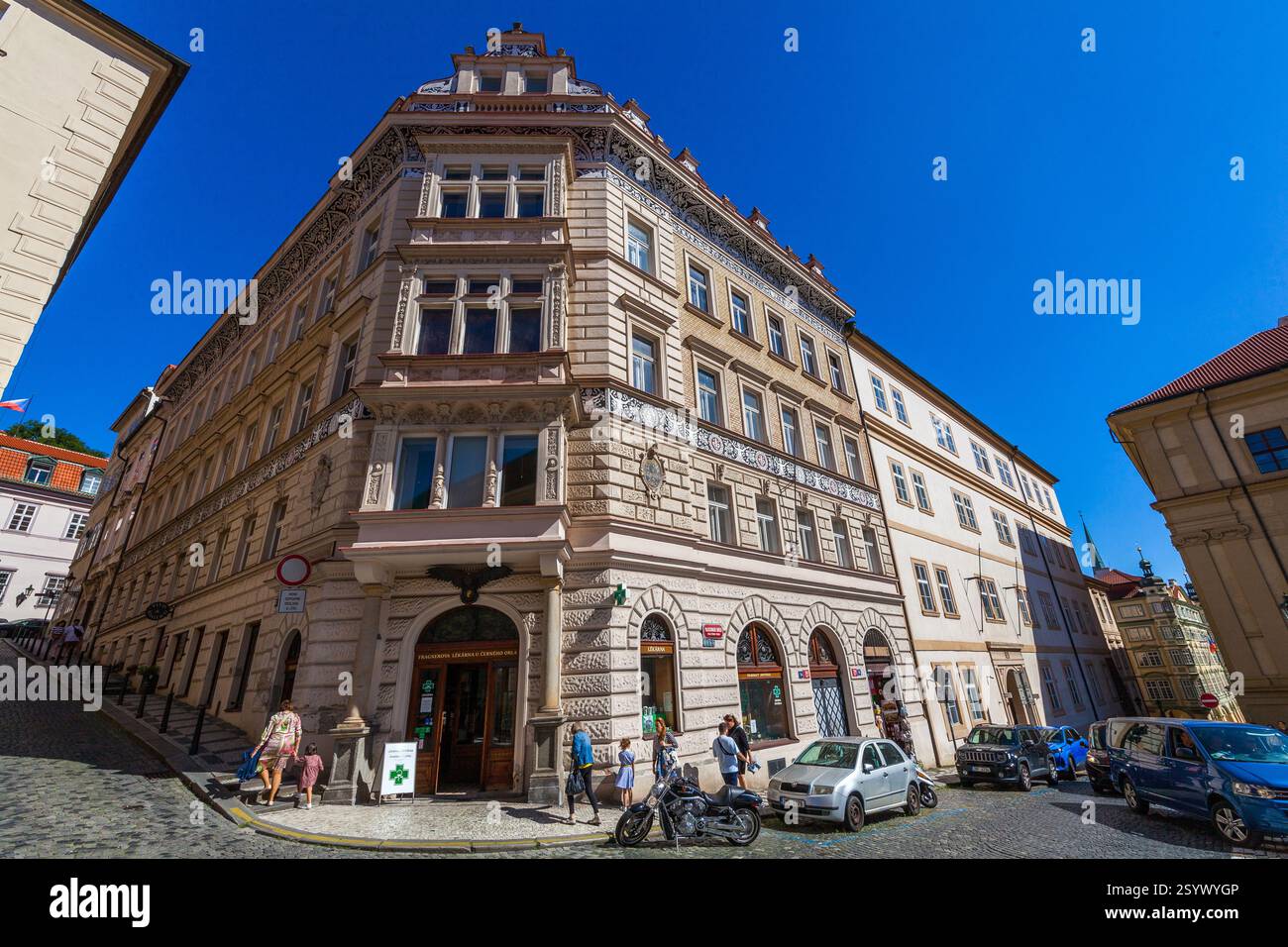 A corner building with a traditional facade featuring ornate details ...
