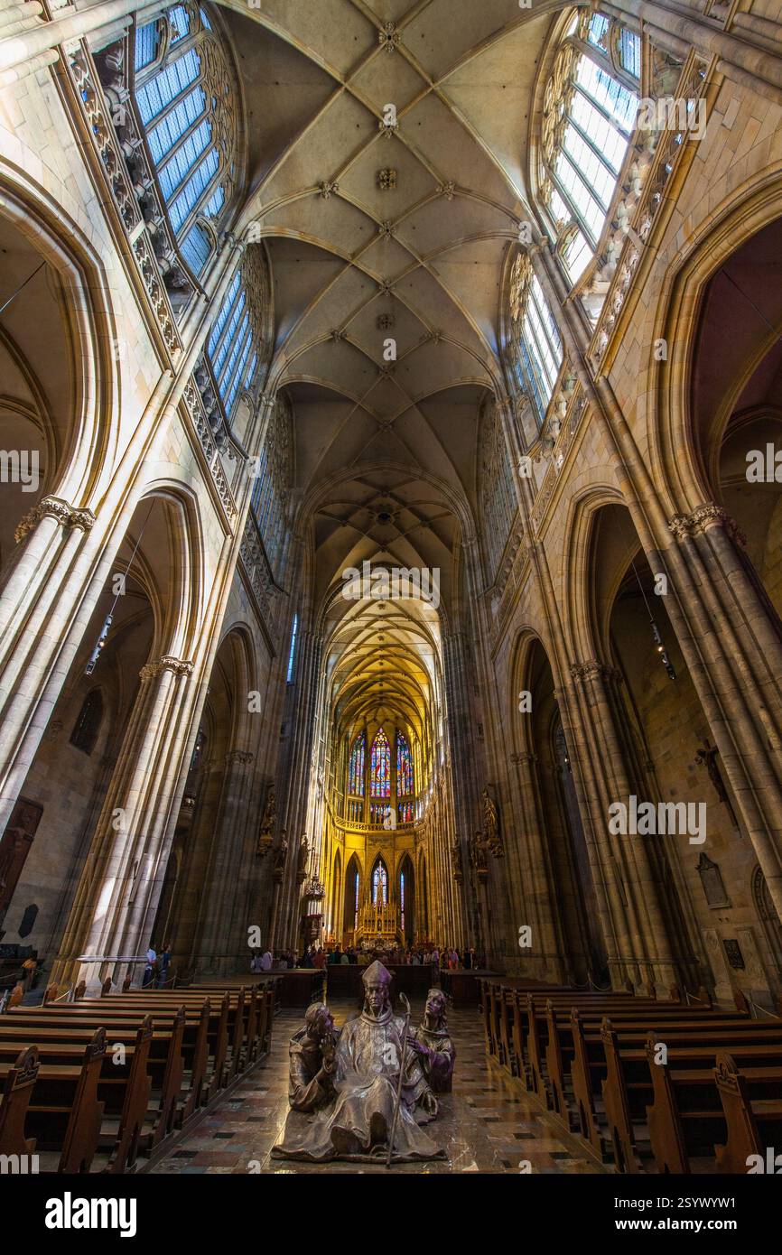 The image depicts the expansive interior of a gothic cathedral ...
