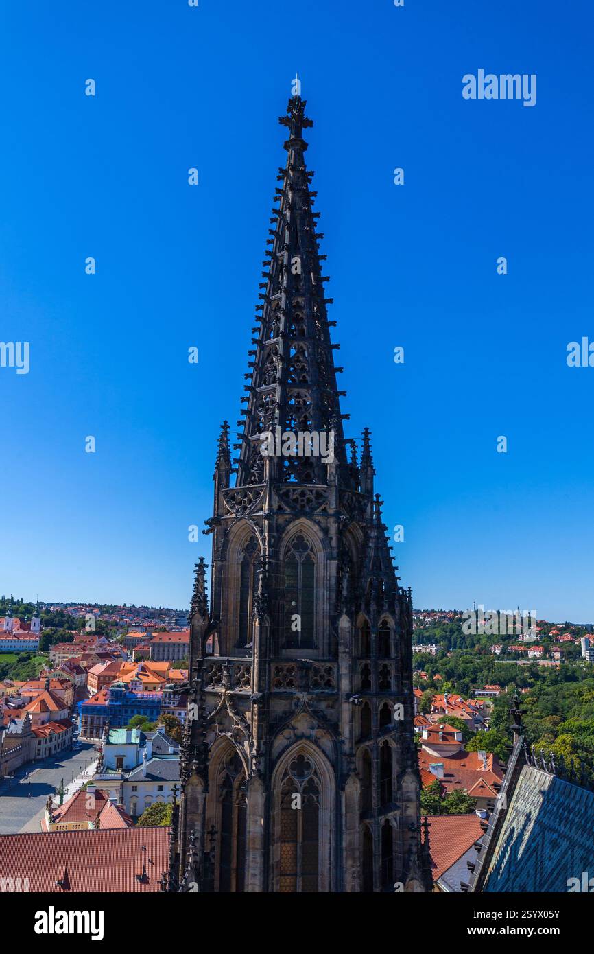 A high-angle shot showcasing the spires of a gothic cathedral rising ...