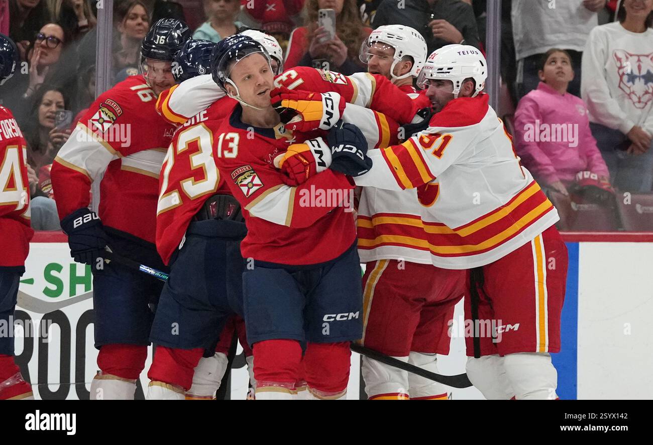 Florida Panthers center Sam Reinhart (13) and Calgary Flames center ...